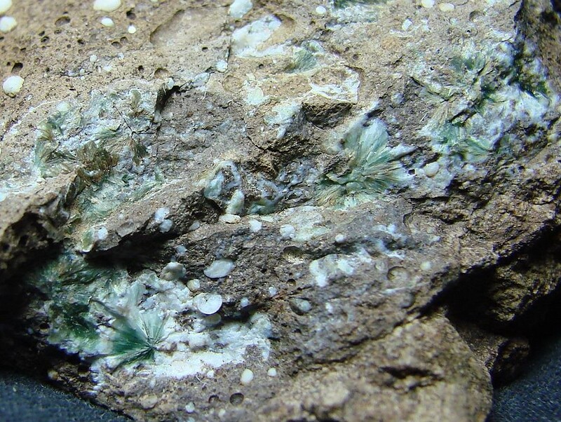 Colorless hexagonal needles of Erionite-K in a small vug. Collection ...