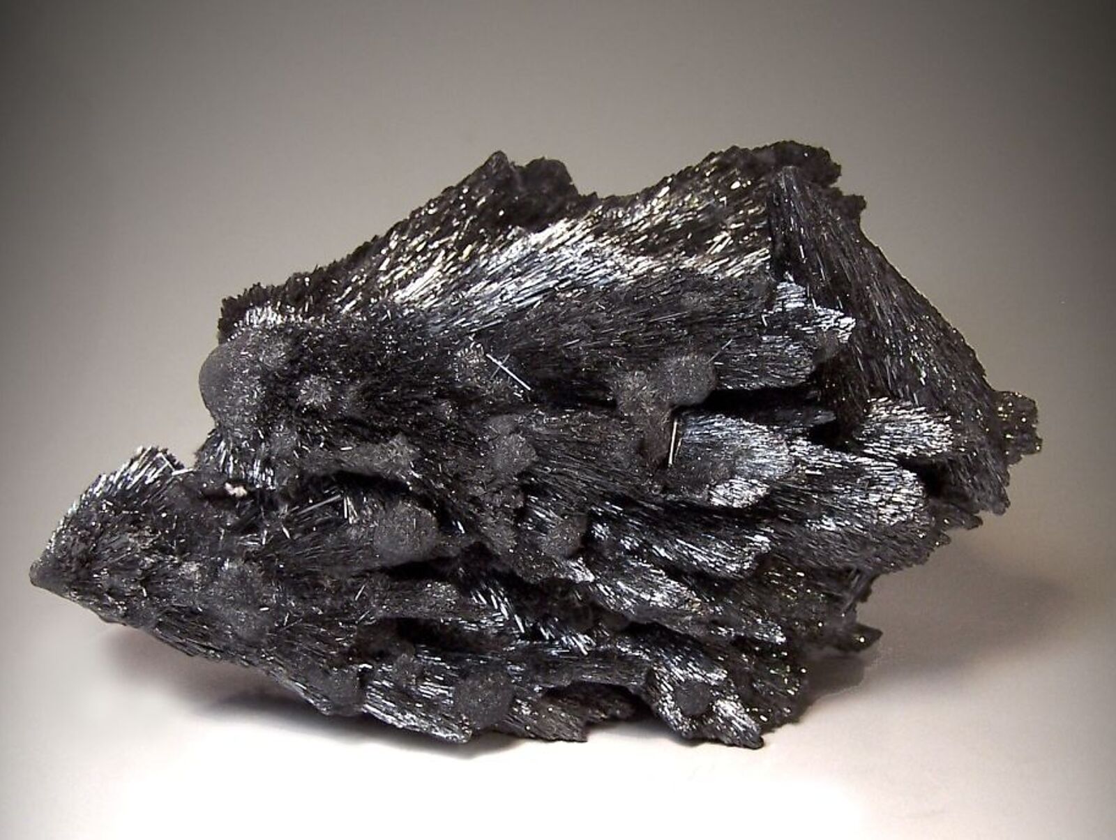 Lustrous, metallic berthierite crystals with bladed clusters to over 10 cm.