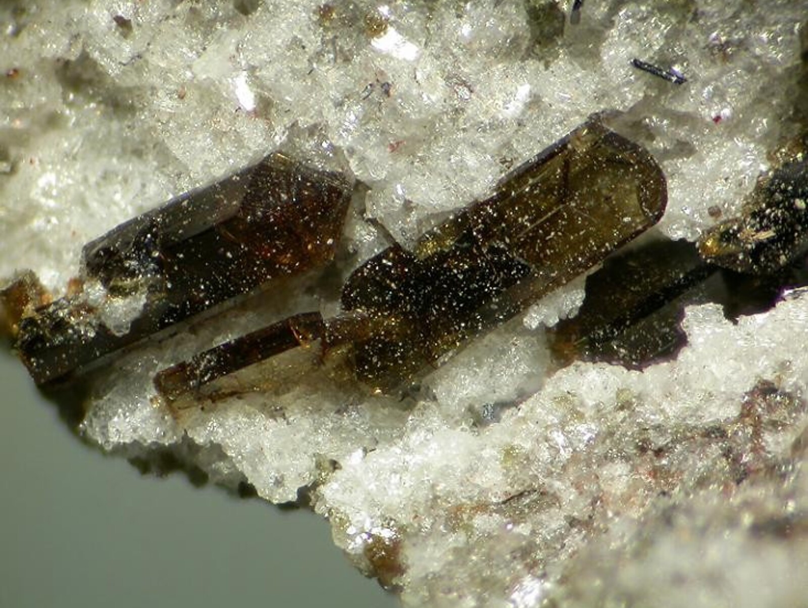Dark olive enstatite crystals with black ilmenite crystals and crude ...