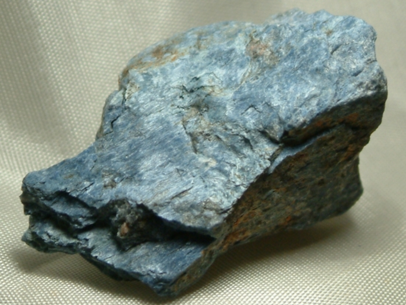 Superb dumortierite crystals included in a colorless, polished, quartz ...