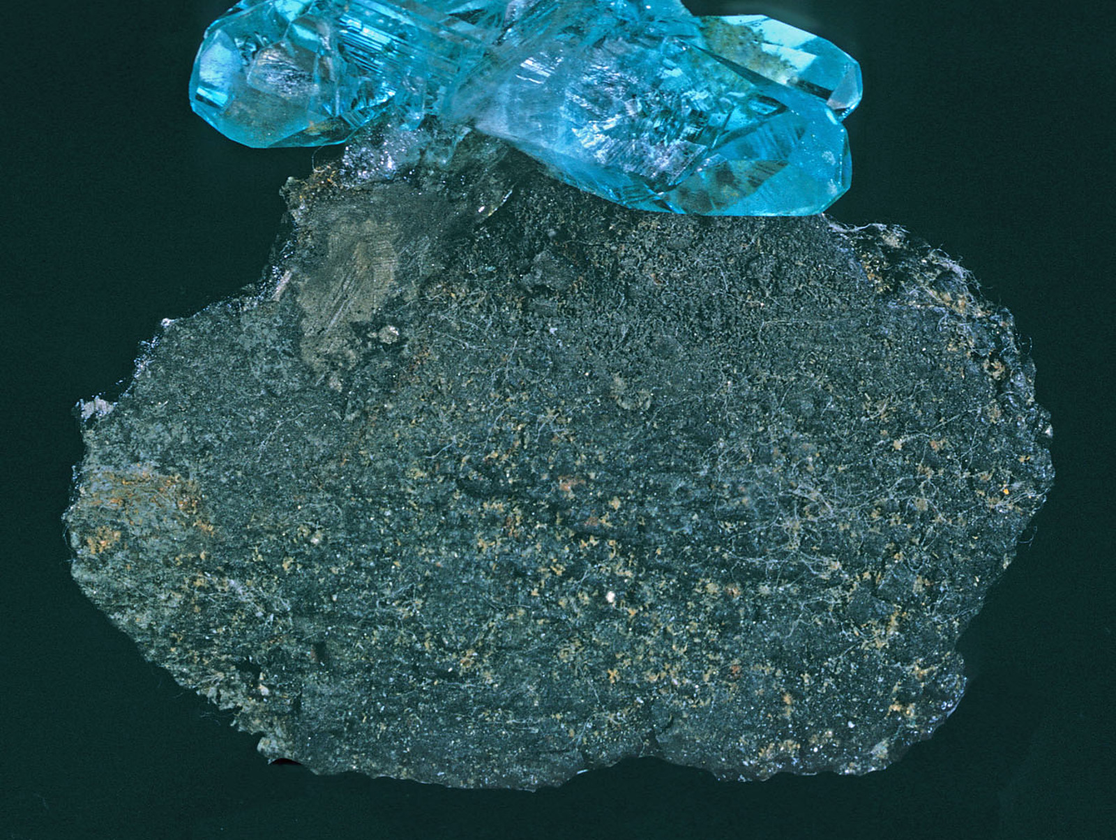Very light green crystals of transparent phosphophyllite, apparently ...