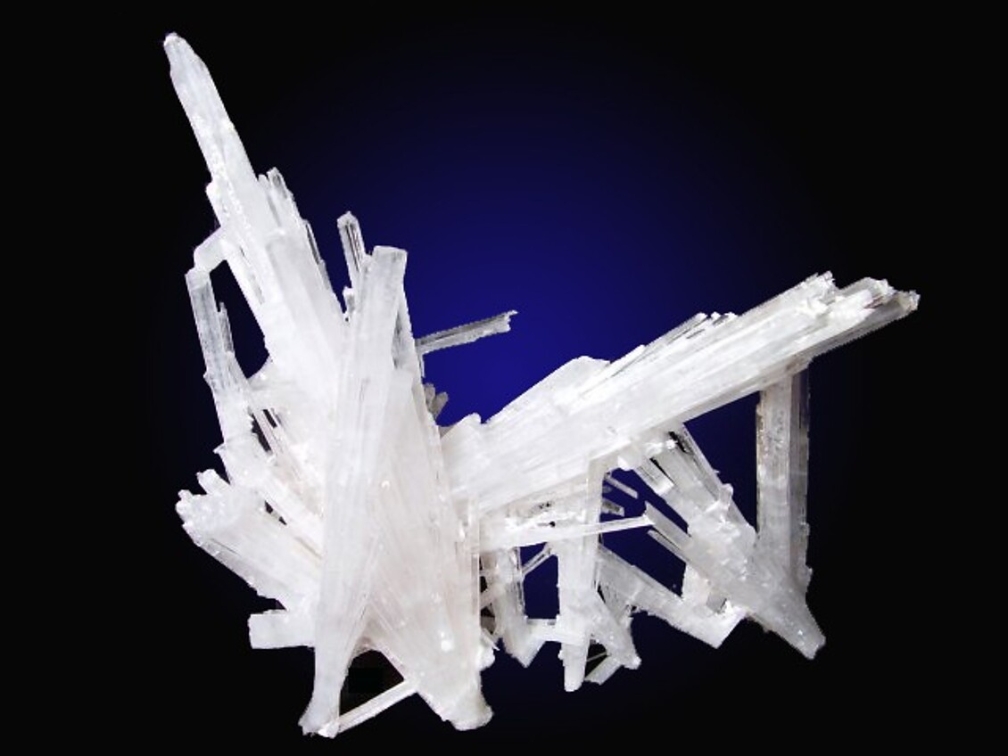 35 x 70 mm specimen of intersecting scolecite crystal clusters. RFC M1200.